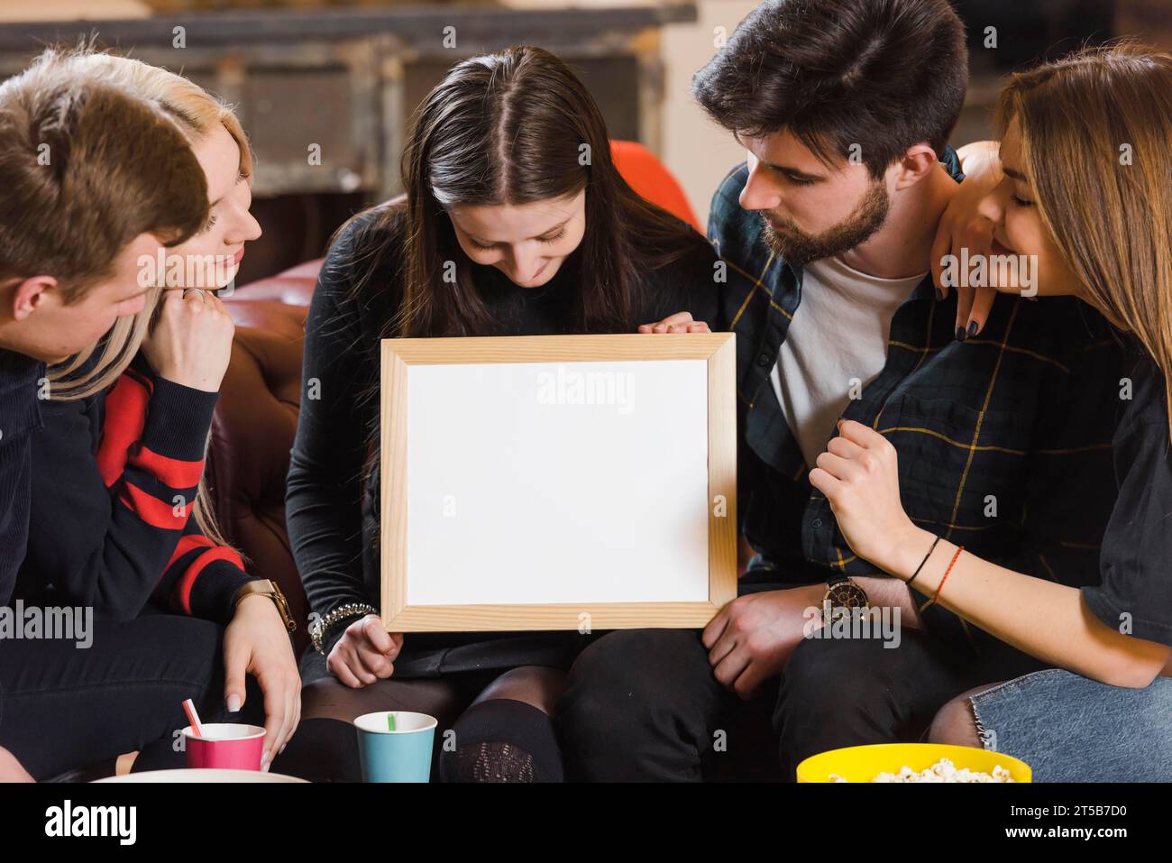 Friends with whiteboard party Stock Photo - Alamy