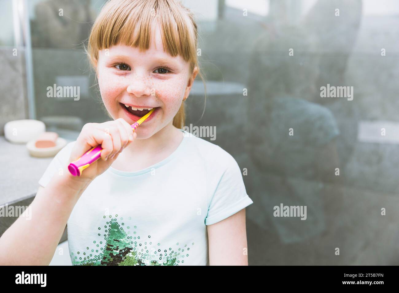 Girl brushing teeth Stock Photo - Alamy