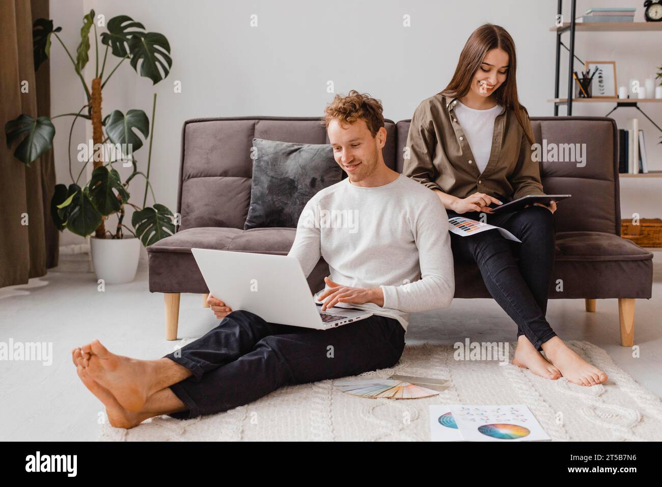Happy loving woman man making plans renovate home together Stock Photo ...