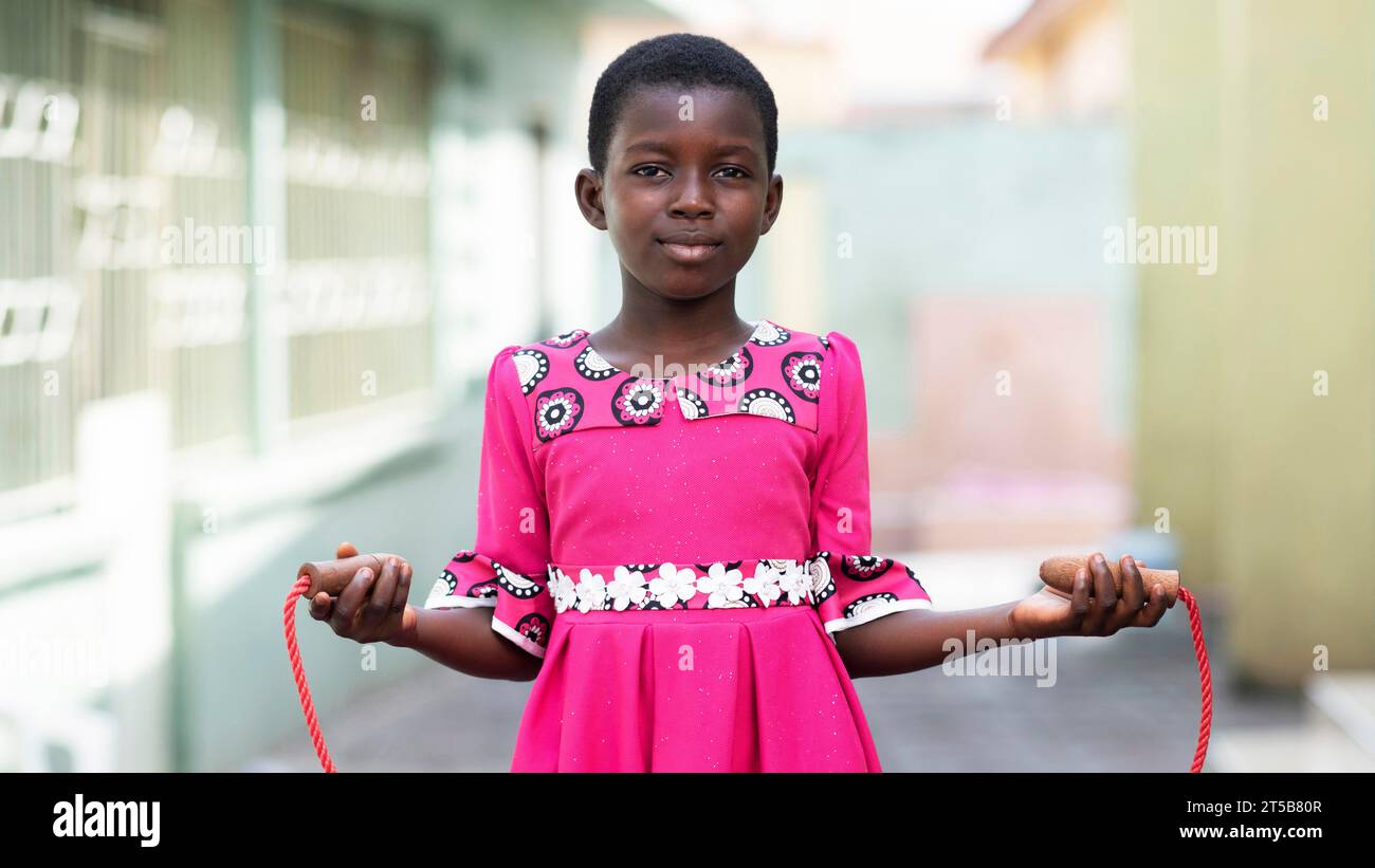 Medium shot kid holding jumping rope Stock Photo - Alamy