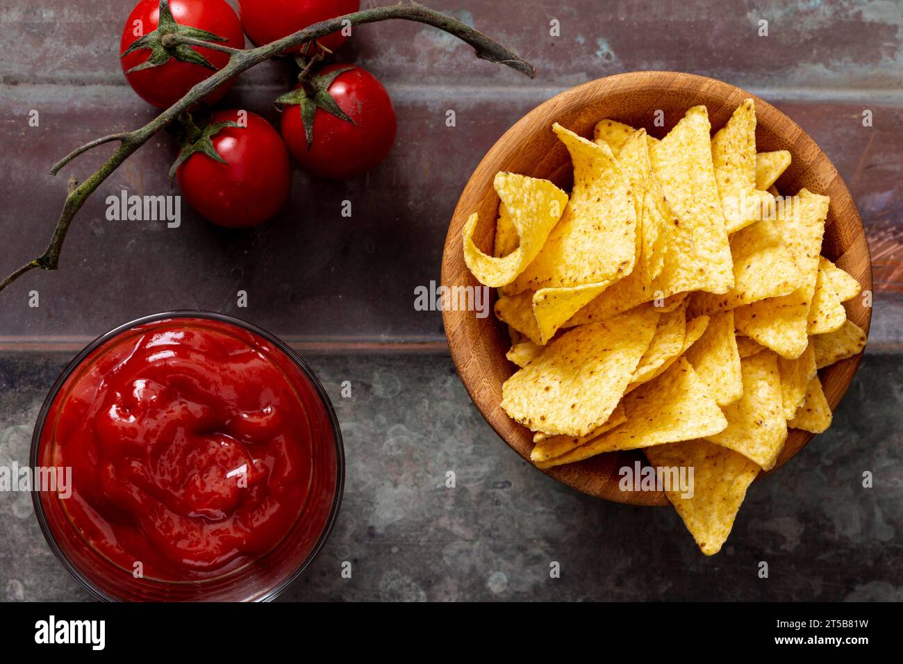 Nachos bowl tomato sauce table Stock Photo - Alamy