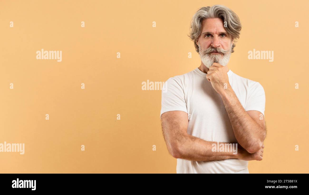 Mid shot old man thinking with copy space Stock Photo - Alamy