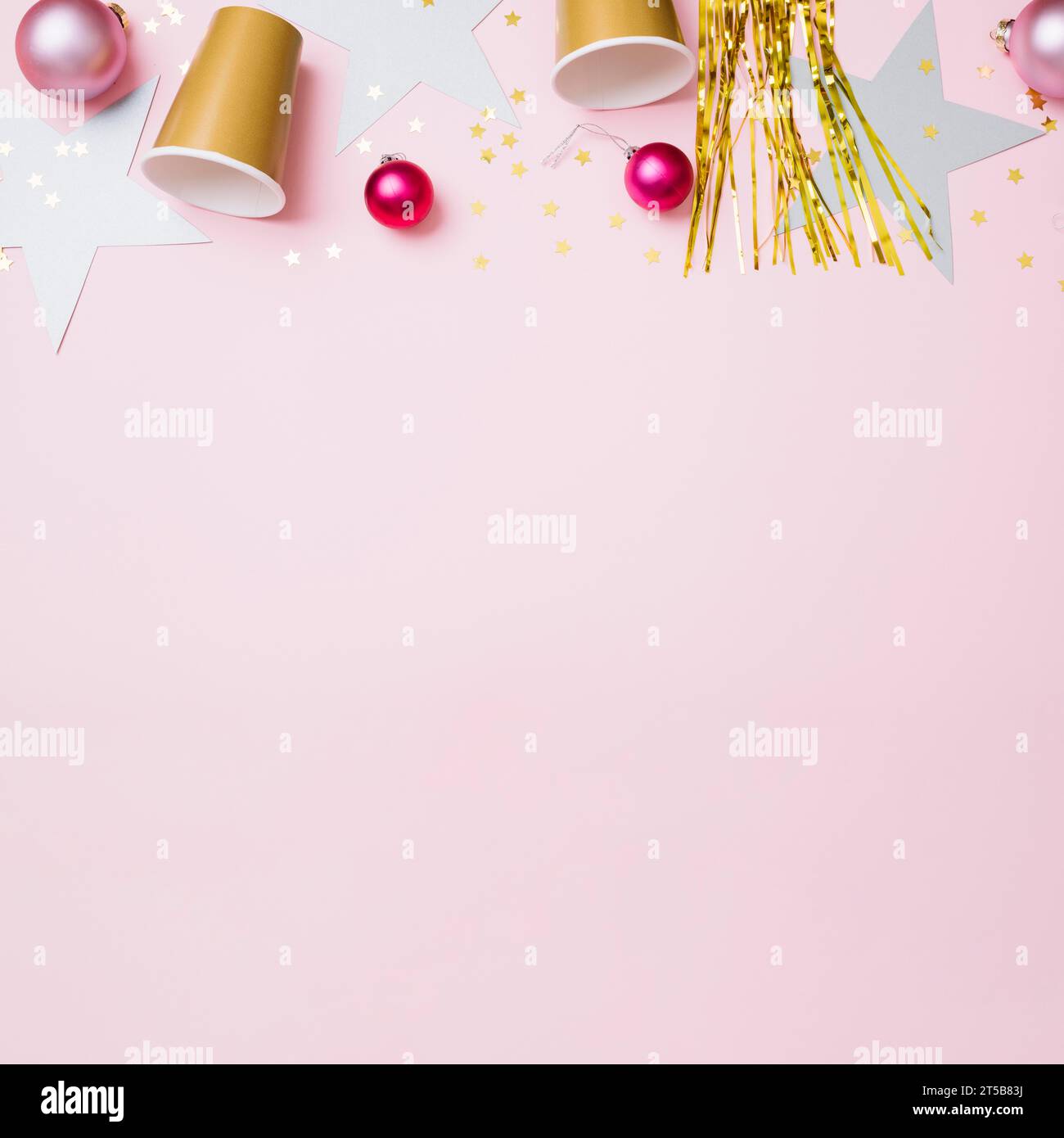 New year composition paper cups with baubles Stock Photo - Alamy