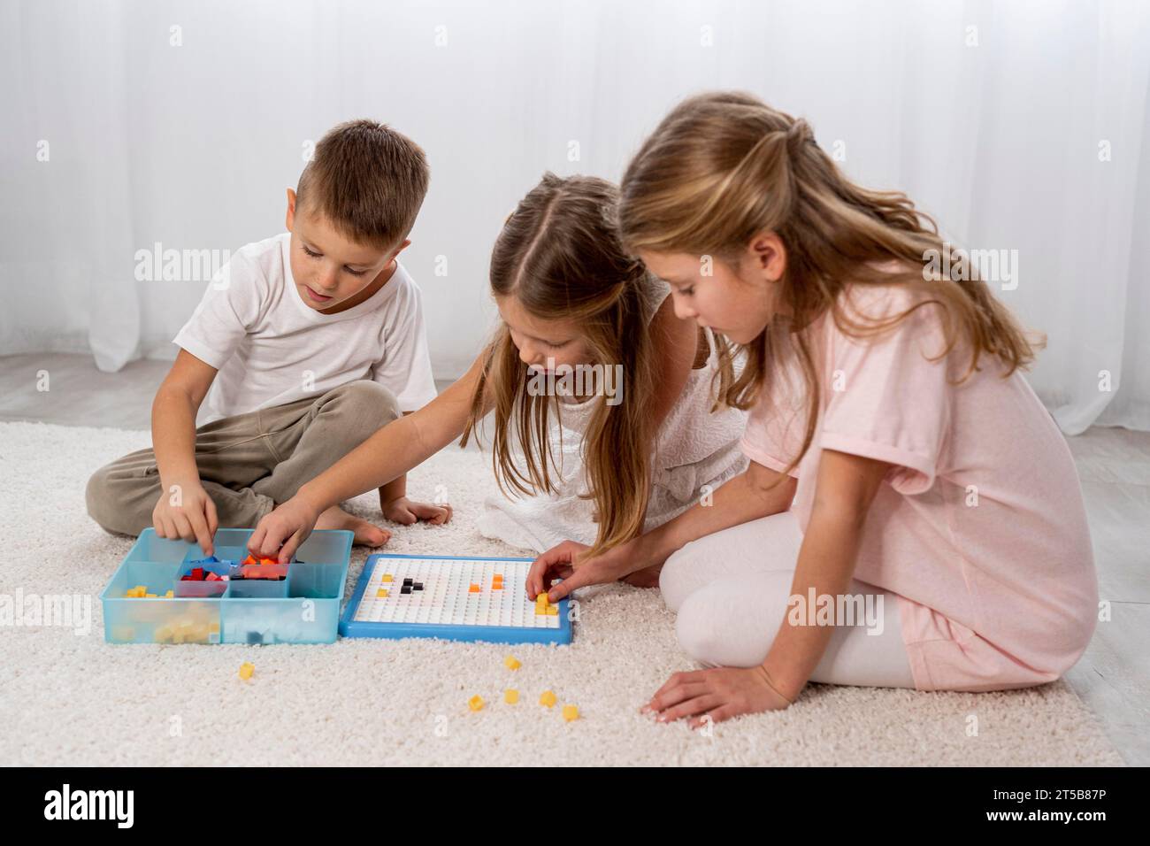 Non binary kids playing Stock Photo - Alamy