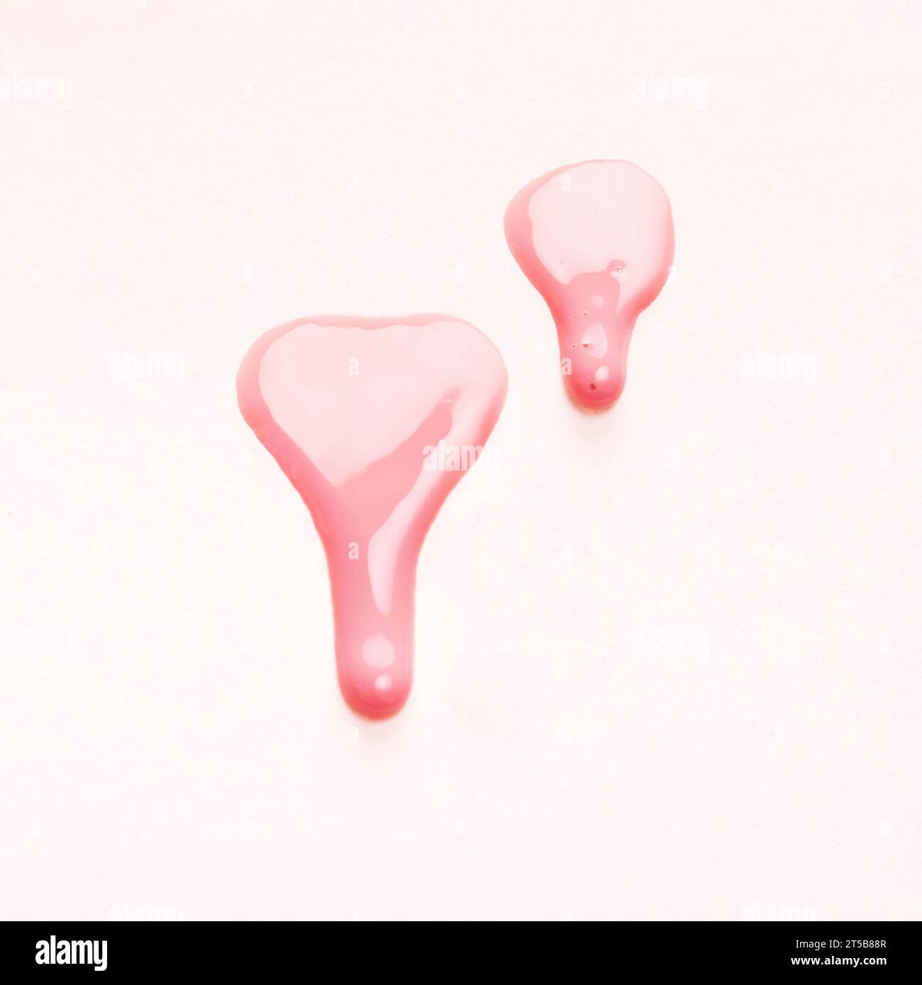 Pink nail polish drops sample isolated white surface Stock Photo - Alamy