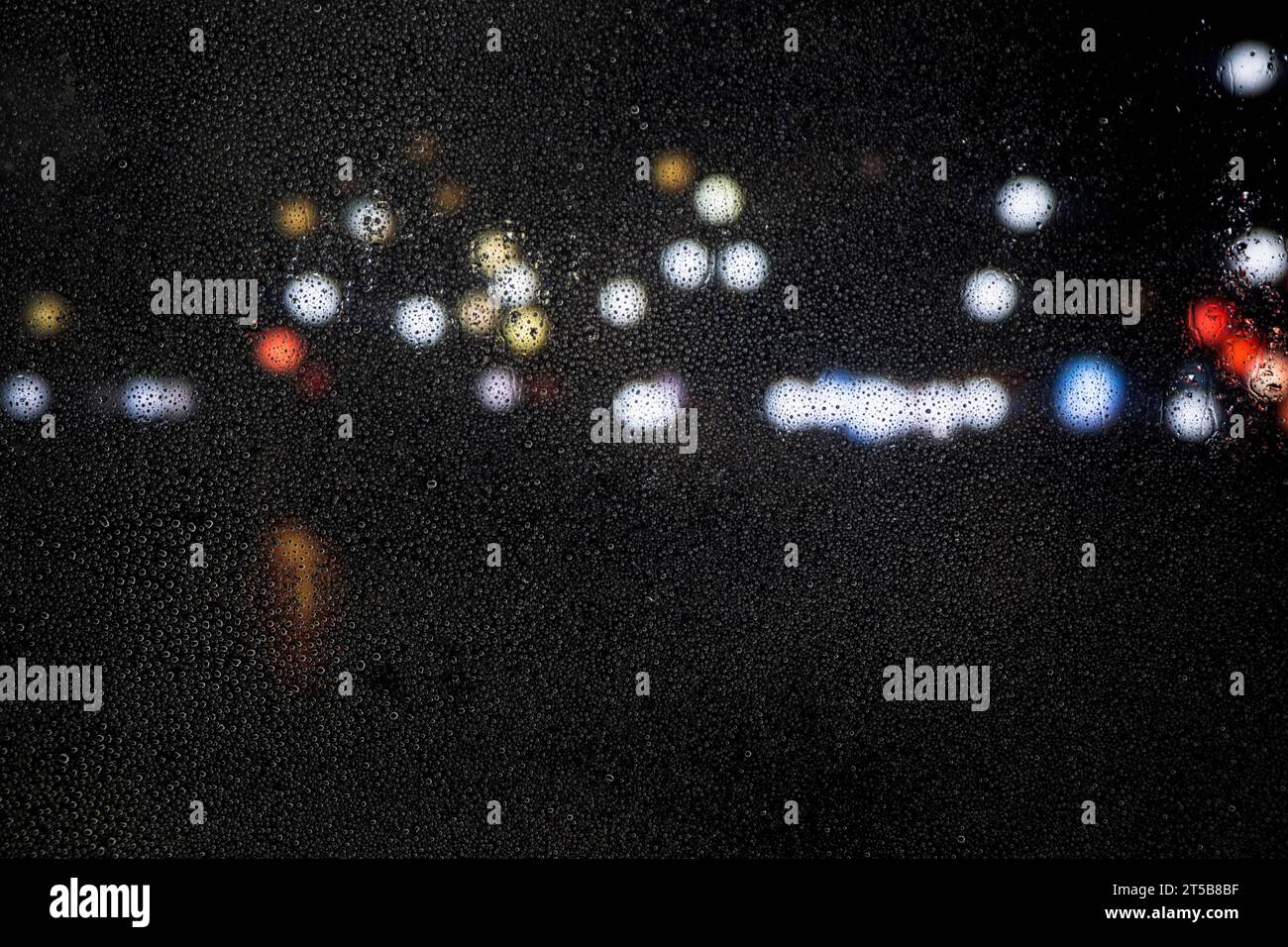 Rain effect city night background Stock Photo - Alamy