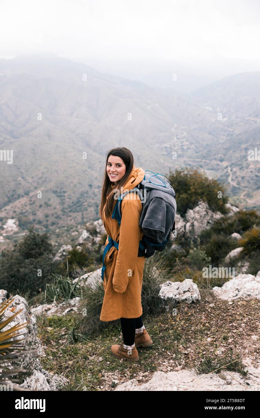 Side view female hiker with her backpack hiking mountains Stock Photo ...