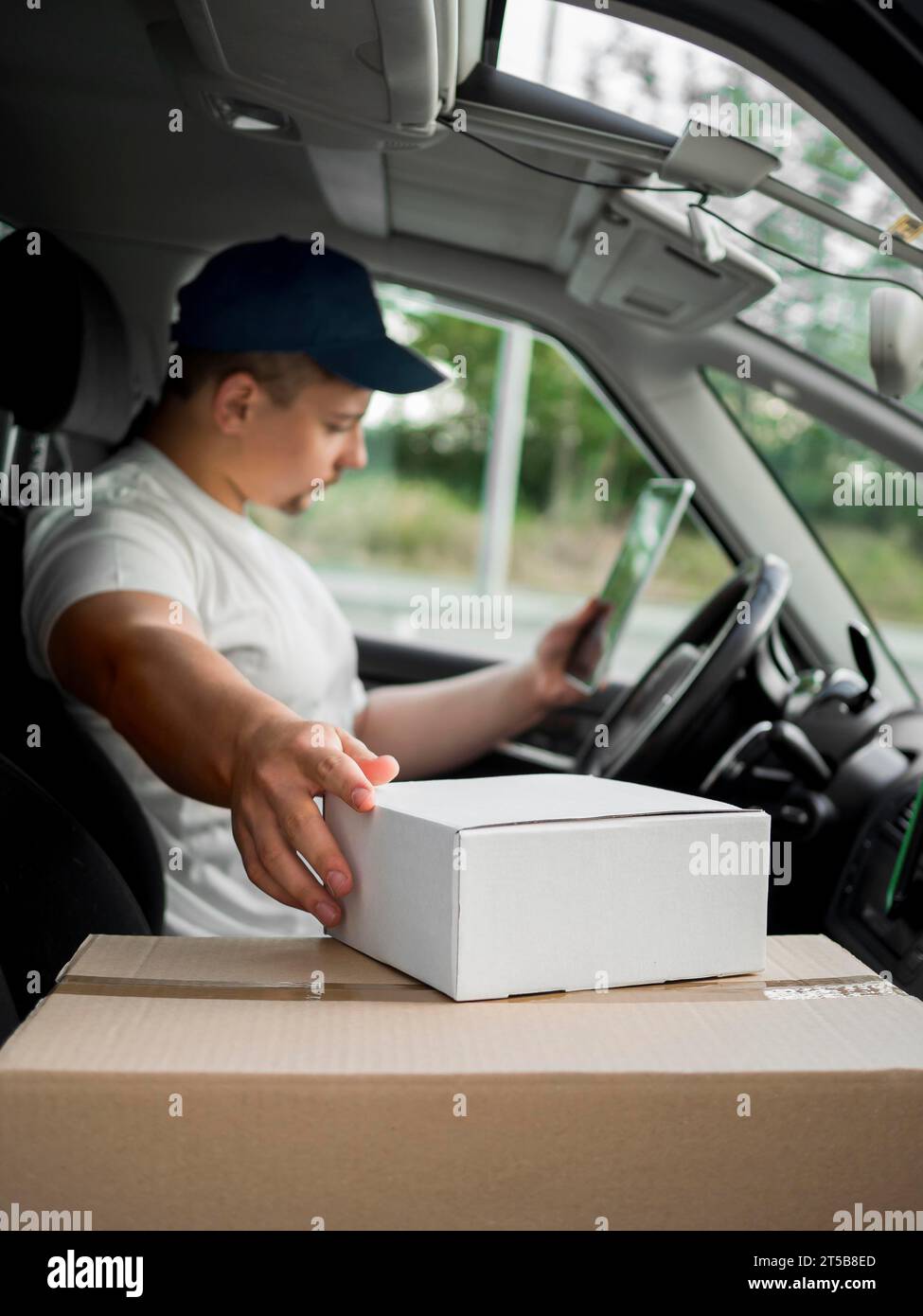 Side view delivery man car Stock Photo - Alamy