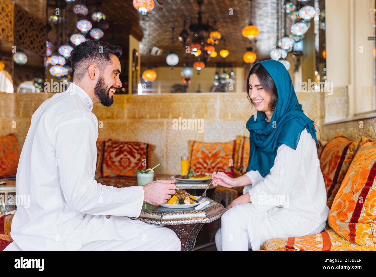 Side view muslim couple arab restaurant Stock Photo - Alamy