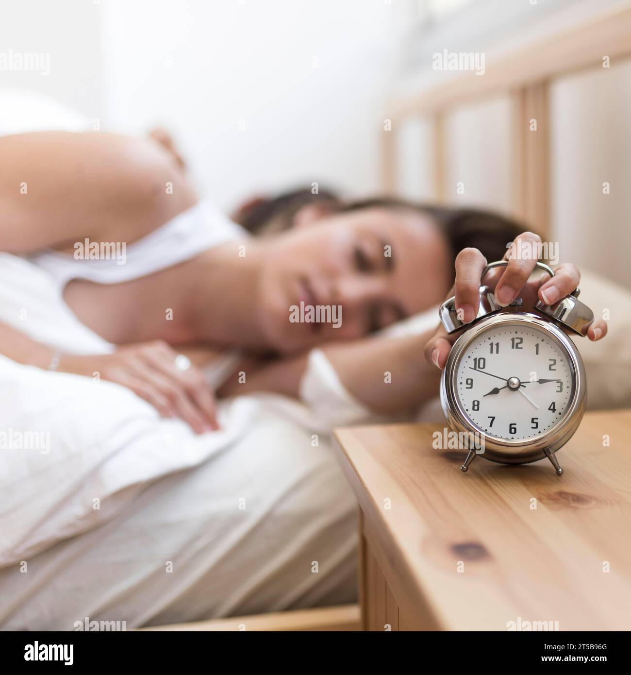 Turning off alarm clock hi-res stock photography and images - Alamy