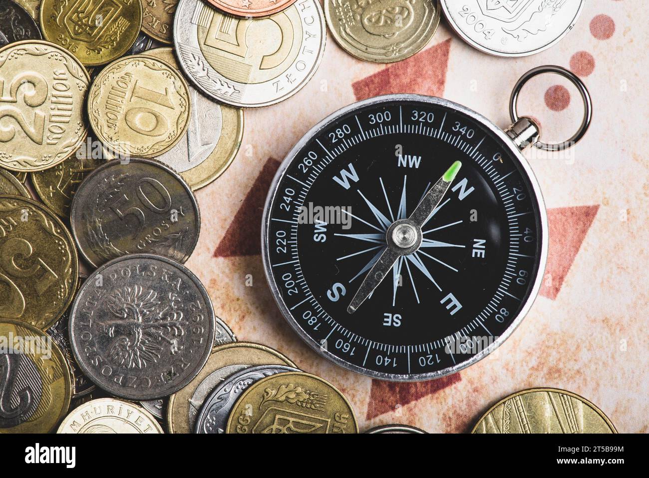 Adventure background with compass coins Stock Photo - Alamy