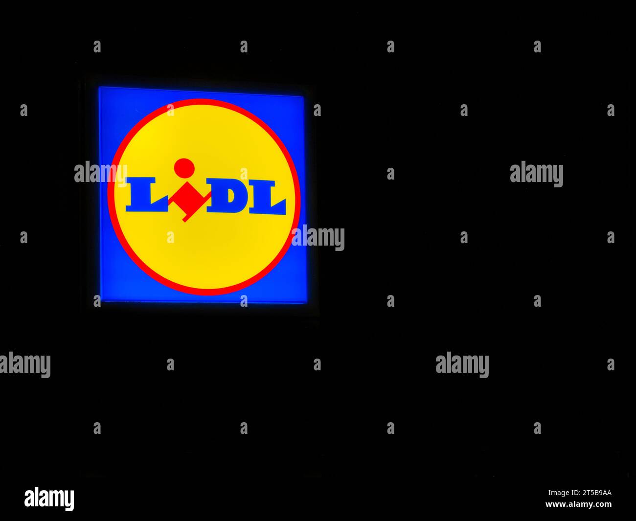 A bright illuminated sign showing the corporate branding of of the ...