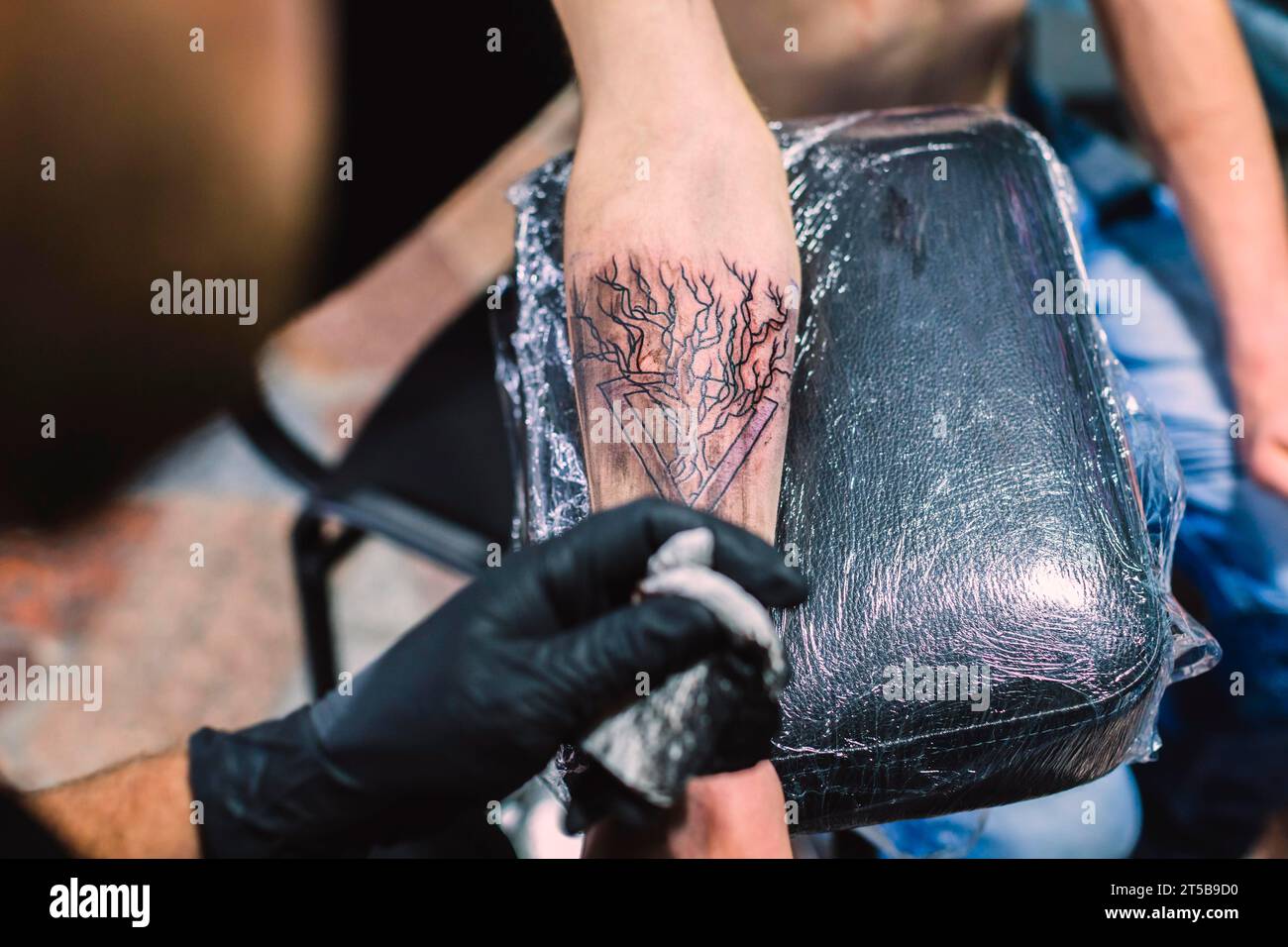 Arm with fresh made tattoo stand Stock Photo - Alamy