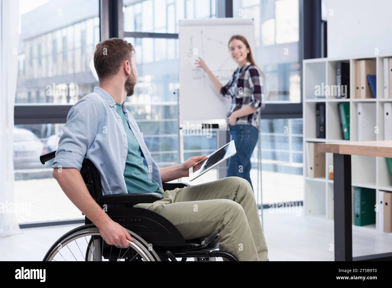Colleagues doing work together Stock Photo - Alamy
