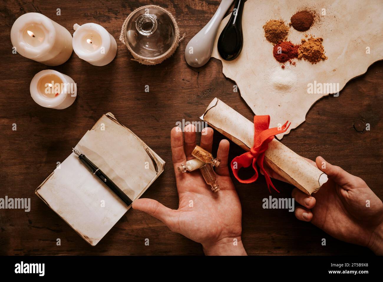Crop hands with bottles scroll Stock Photo - Alamy