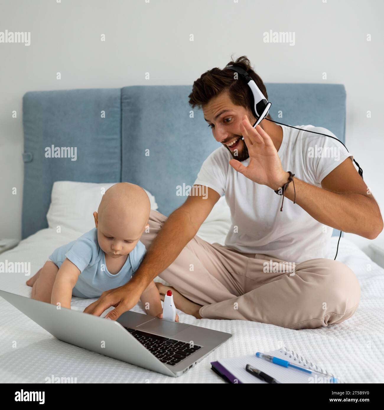Dad working from home during quarantine with child Stock Photo - Alamy