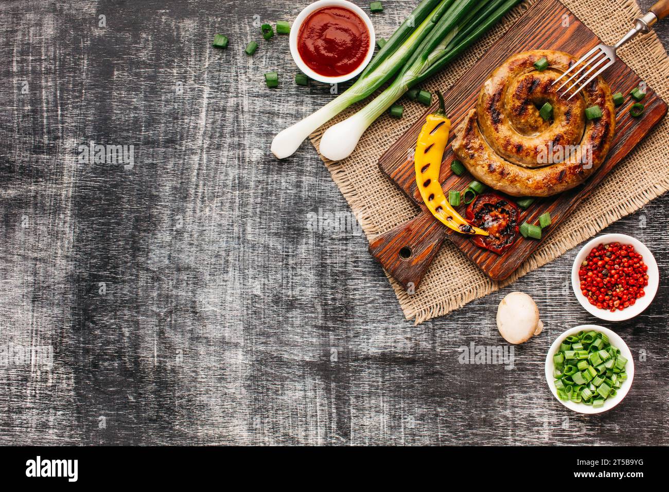 Delicious barbecue fast food grey wooden table Stock Photo - Alamy