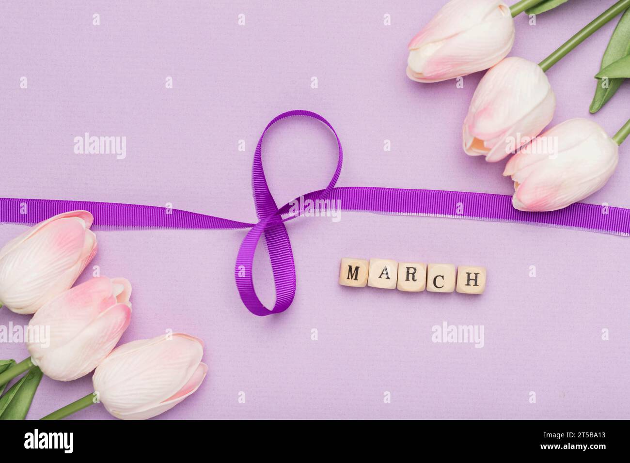 Elegant ribbon symbol flowers Stock Photo - Alamy