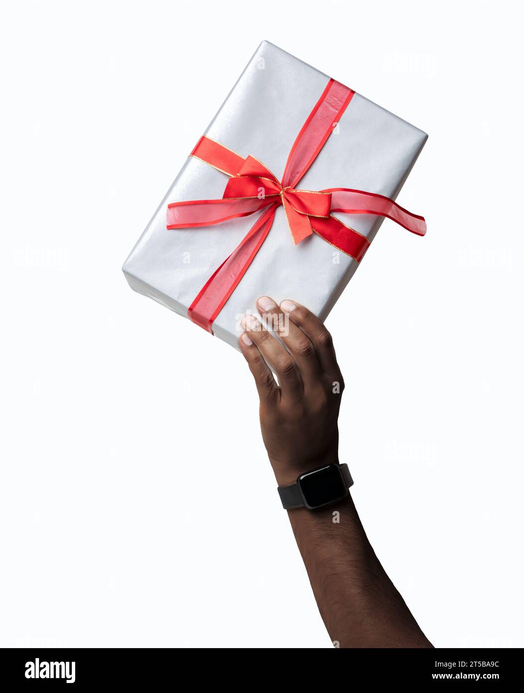 Close-up of male hand raising Christmas present up with xmas with white ...