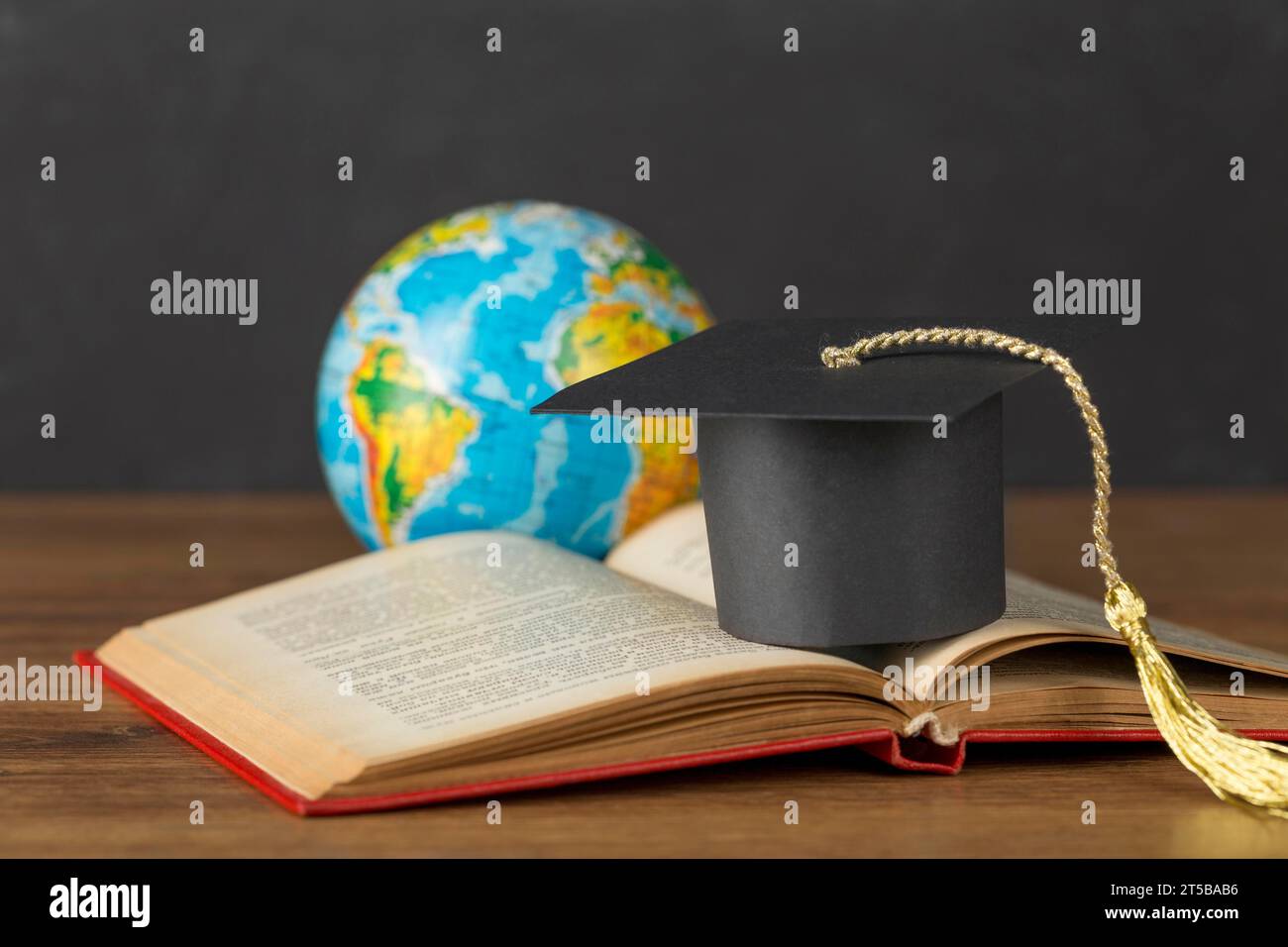 Graduation cap earth globe arrangement Stock Photo - Alamy