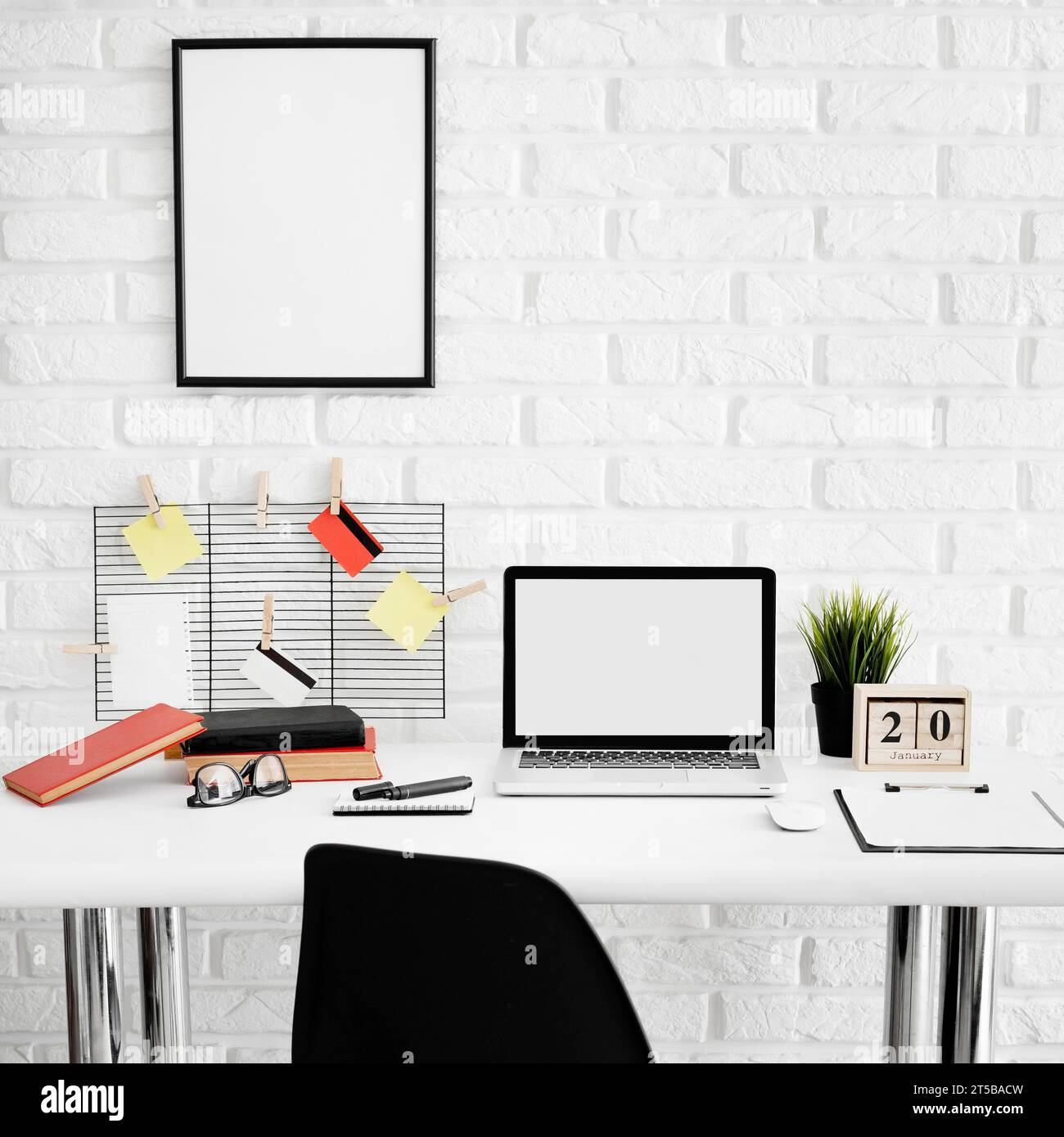 Front view office desk with laptop chair Stock Photo - Alamy