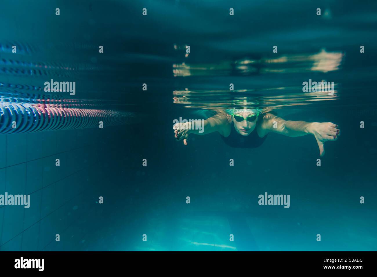 Front view swimmer diving Stock Photo - Alamy