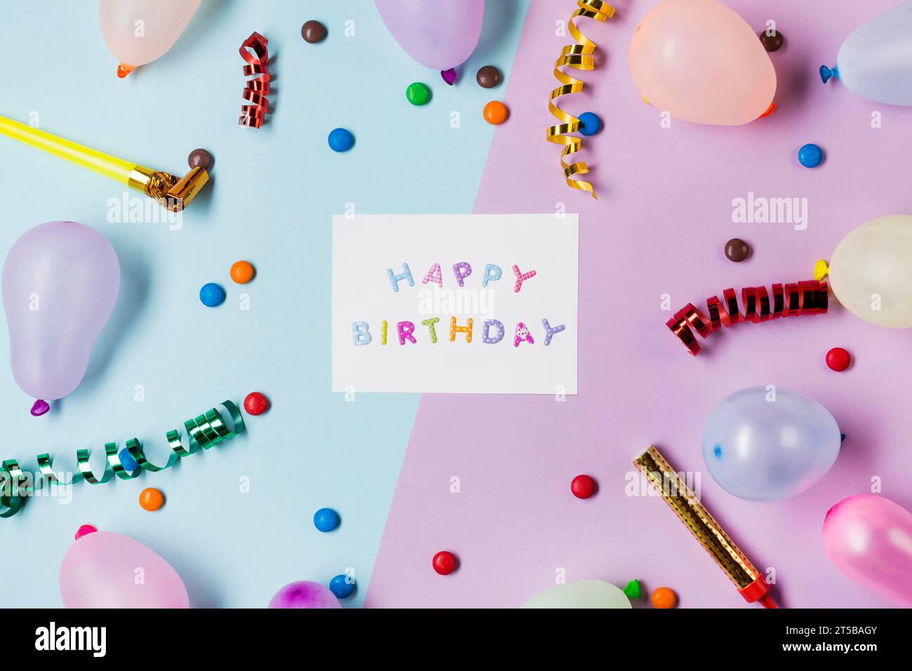 Happy birthday message blue pink surrounded with streamers gems ...