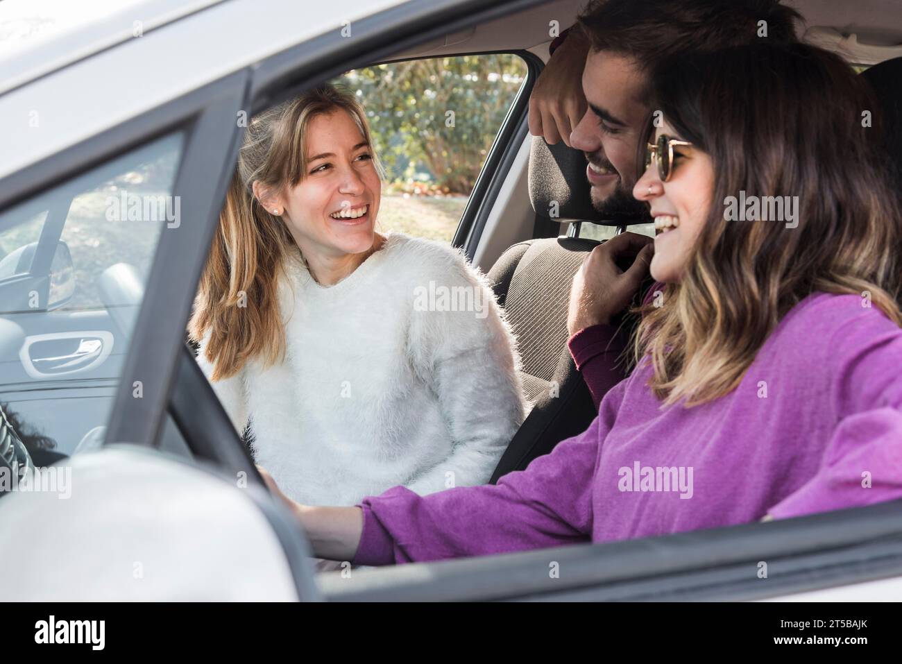 Happy people riding car Stock Photo - Alamy