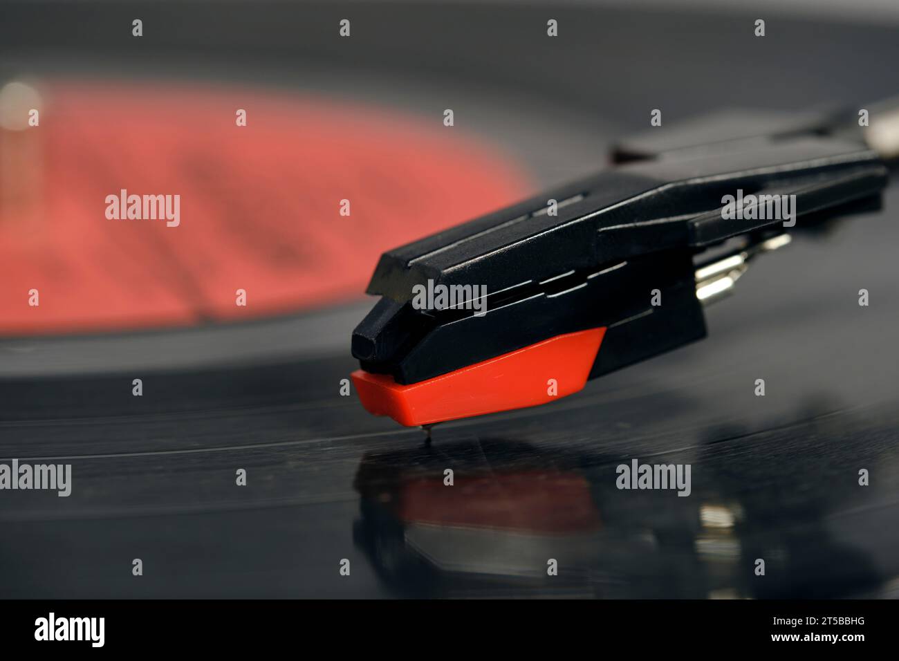 Needle of vinyl player is mounted on record. Closeup on macro photos ...
