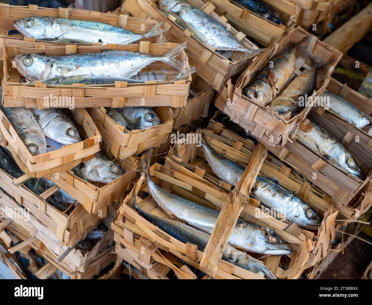 Ikan Pindang or salted fish in bamboo packaging on traditional market ...