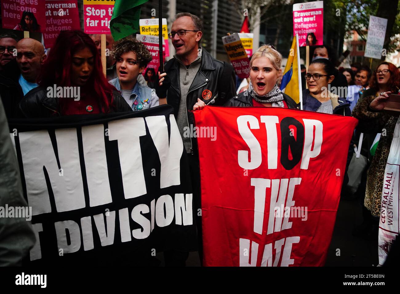 People from Extinction Rebellion and Stand Up to Racism take part in a ...