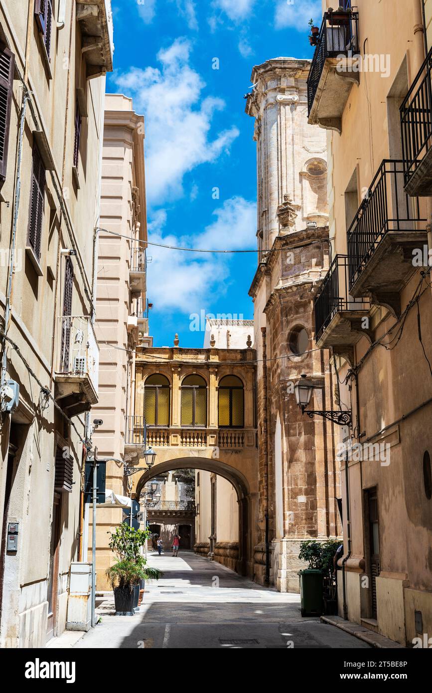 Street of classic buildings with an elevated exterior walkway ...