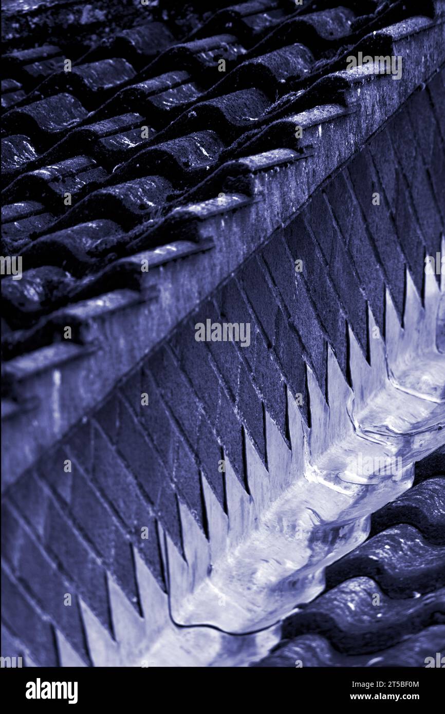 lead flashing valley, clay tiles and house gable end in cold light ...