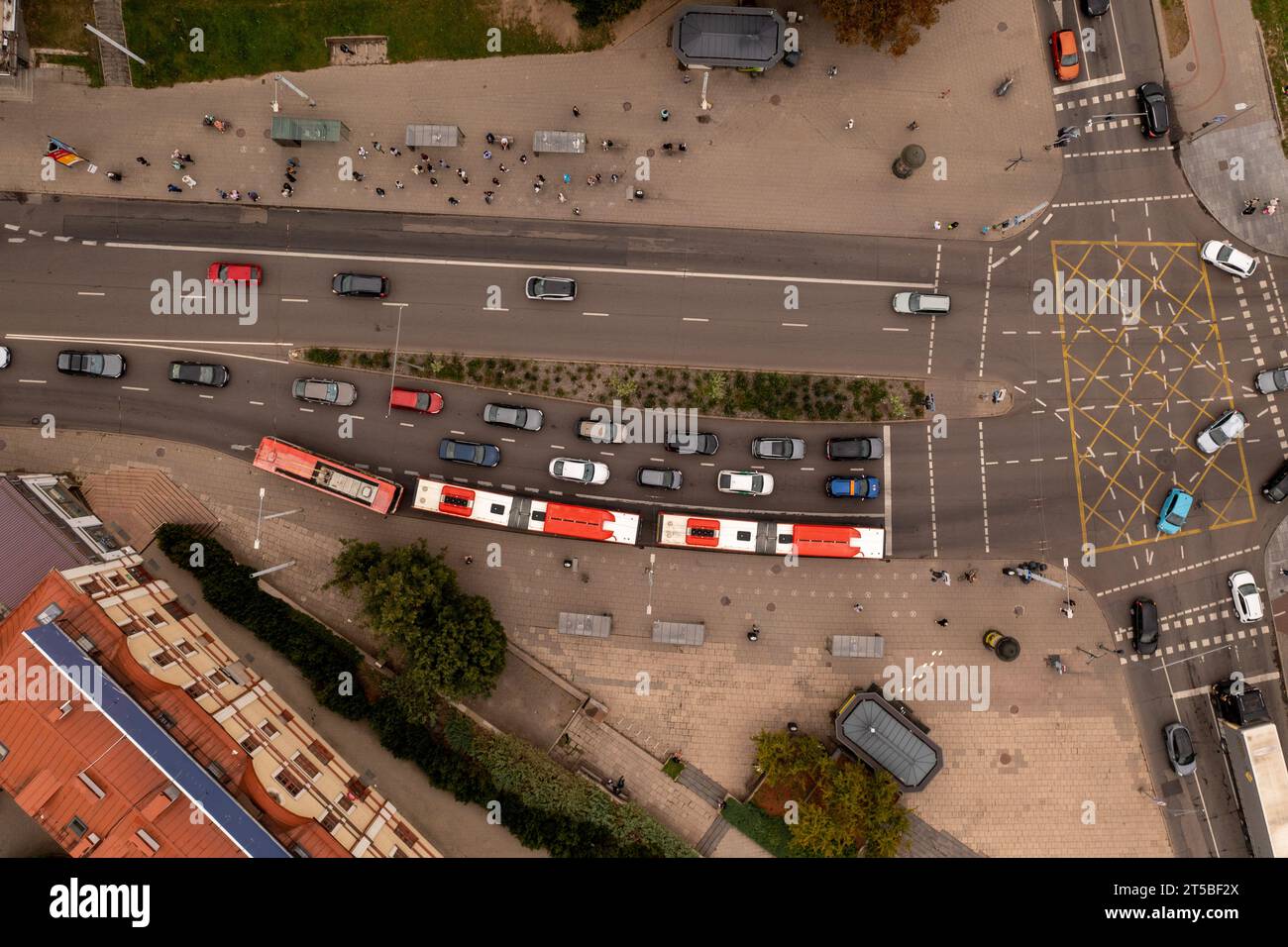 Drone photography of high traffic intersection and bus stop with buses ...