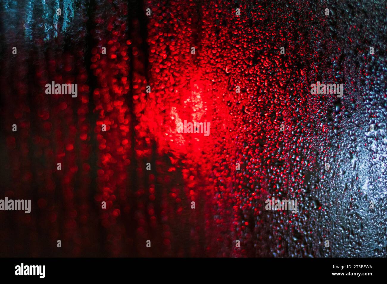 Shot of the window with blurred lights on the background and ...