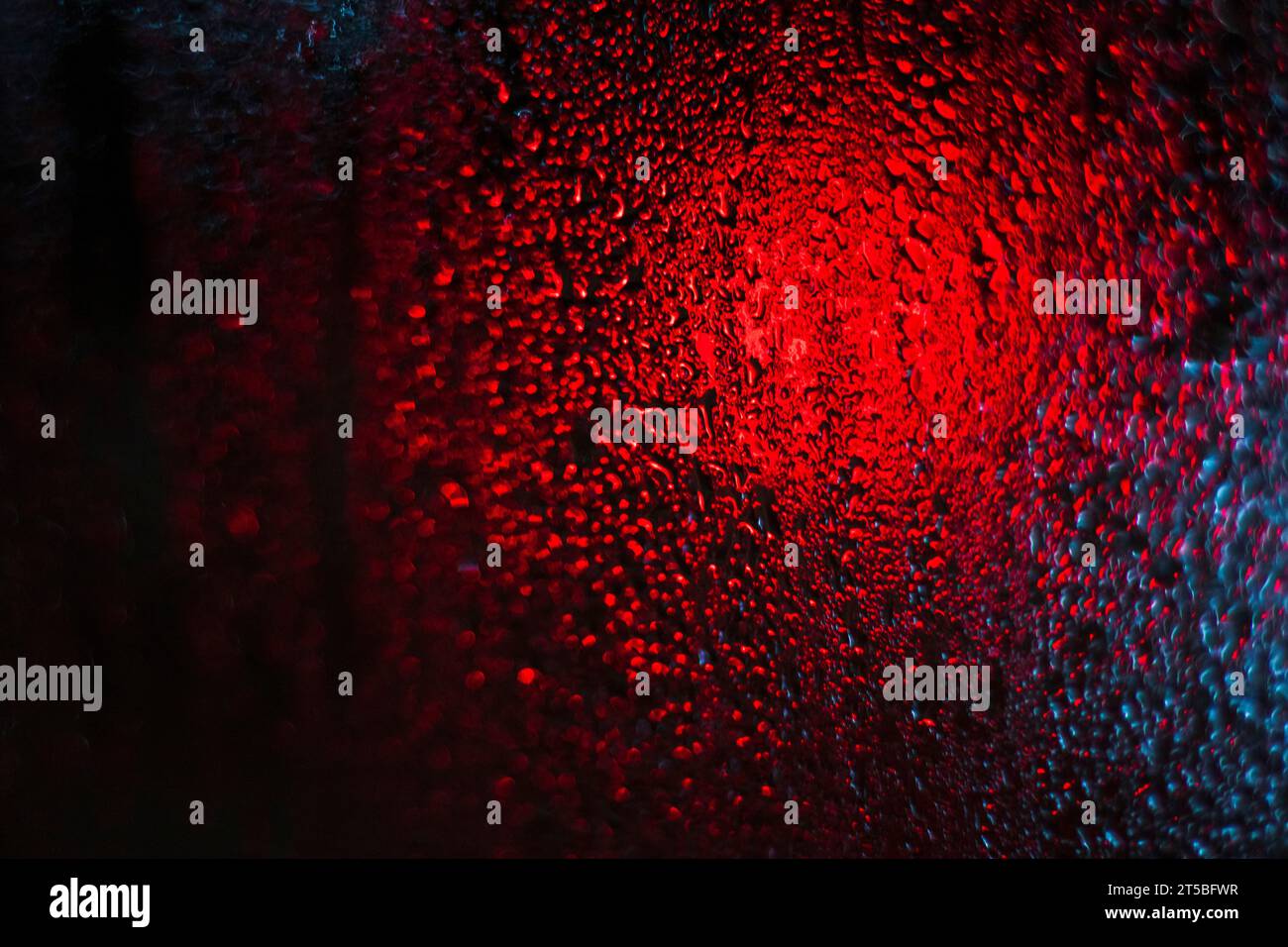 Shot of the window with blurred lights on the background and ...