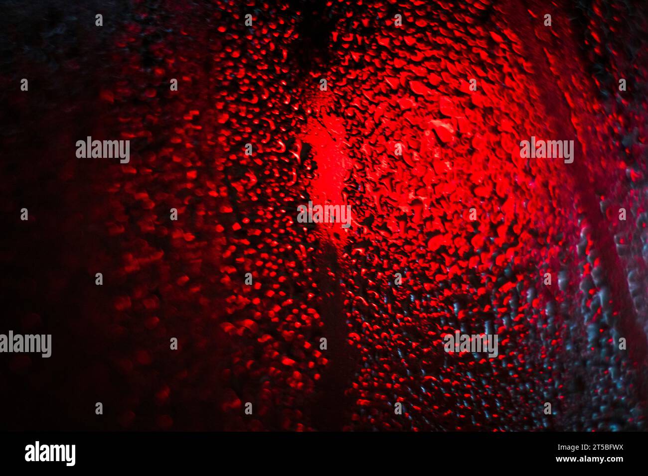 Shot of the window with blurred lights on the background and ...