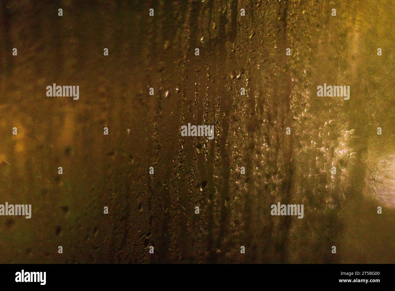 Shot of the window with blurred lights on the background and ...