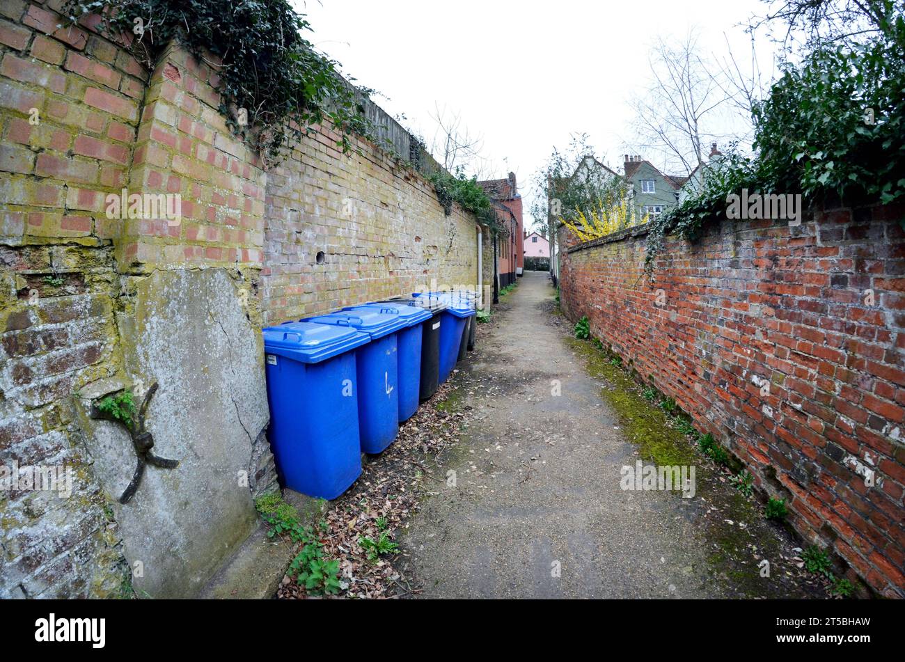 rubbish bins in back alley, bungay suffolk england Stock Photo - Alamy