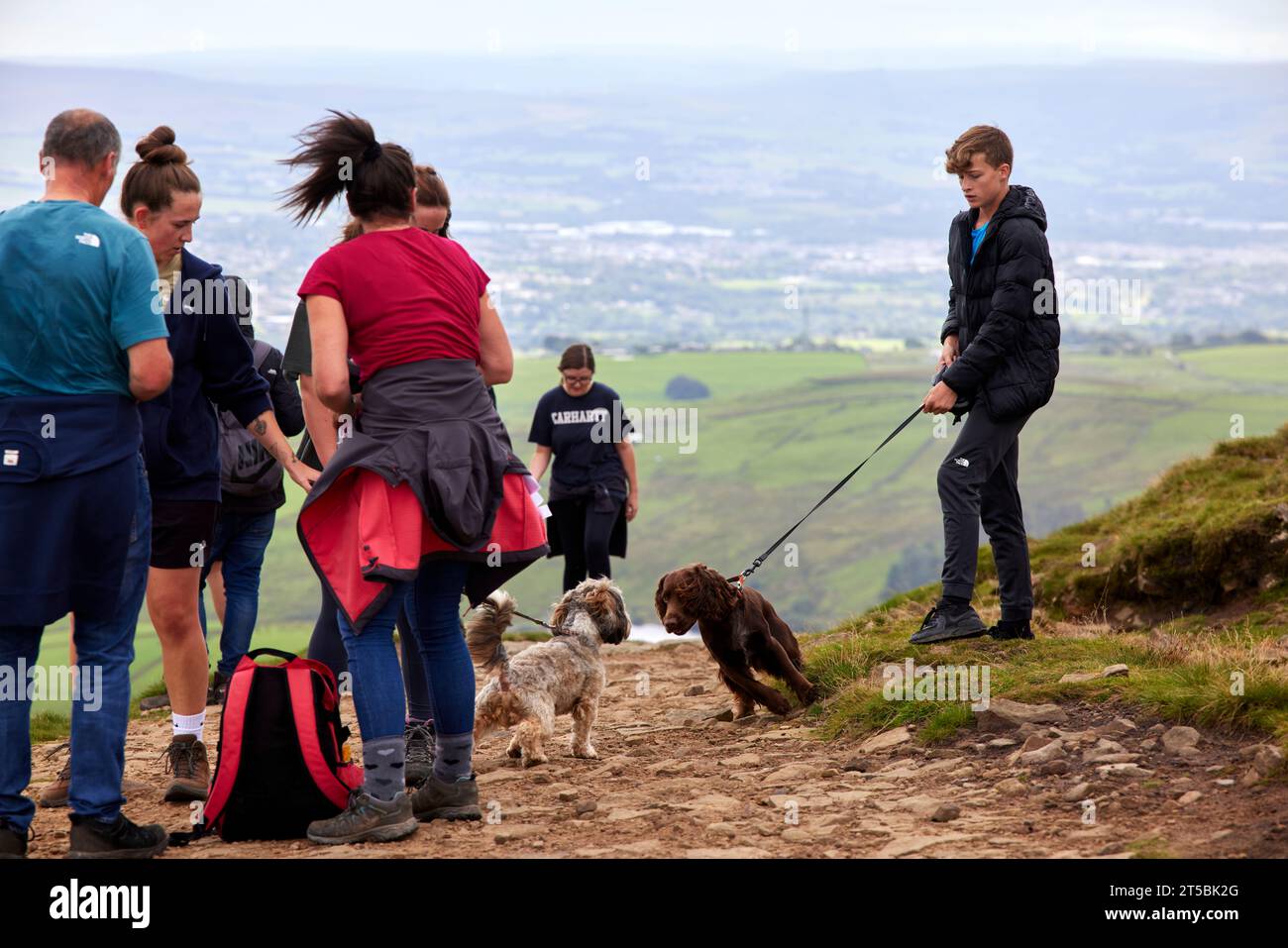 Walkers on the steep walkway up Pendle Hill east of Lancashire, England ...