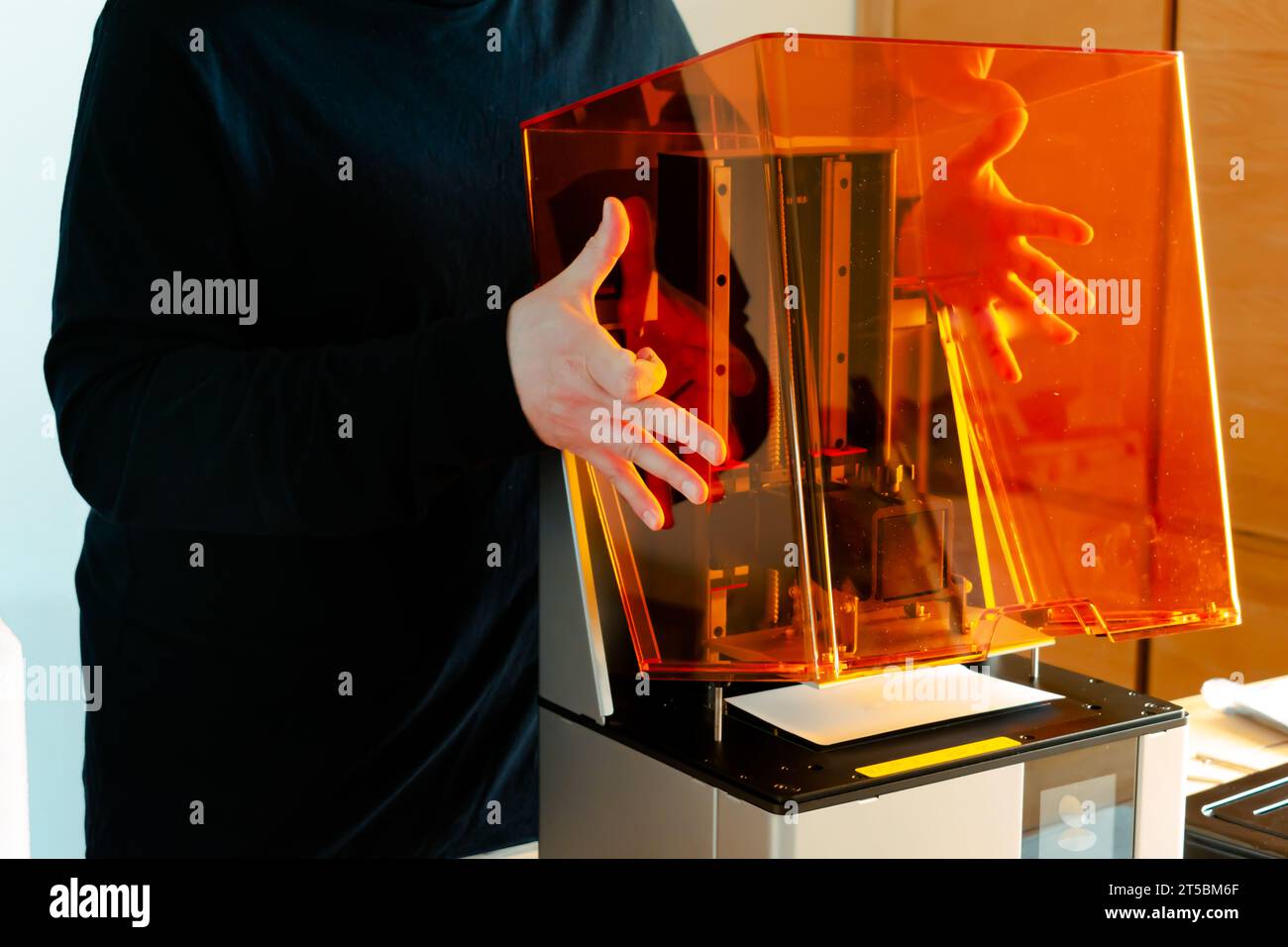 Man preparing a 3d resin printer before use Stock Photo - Alamy