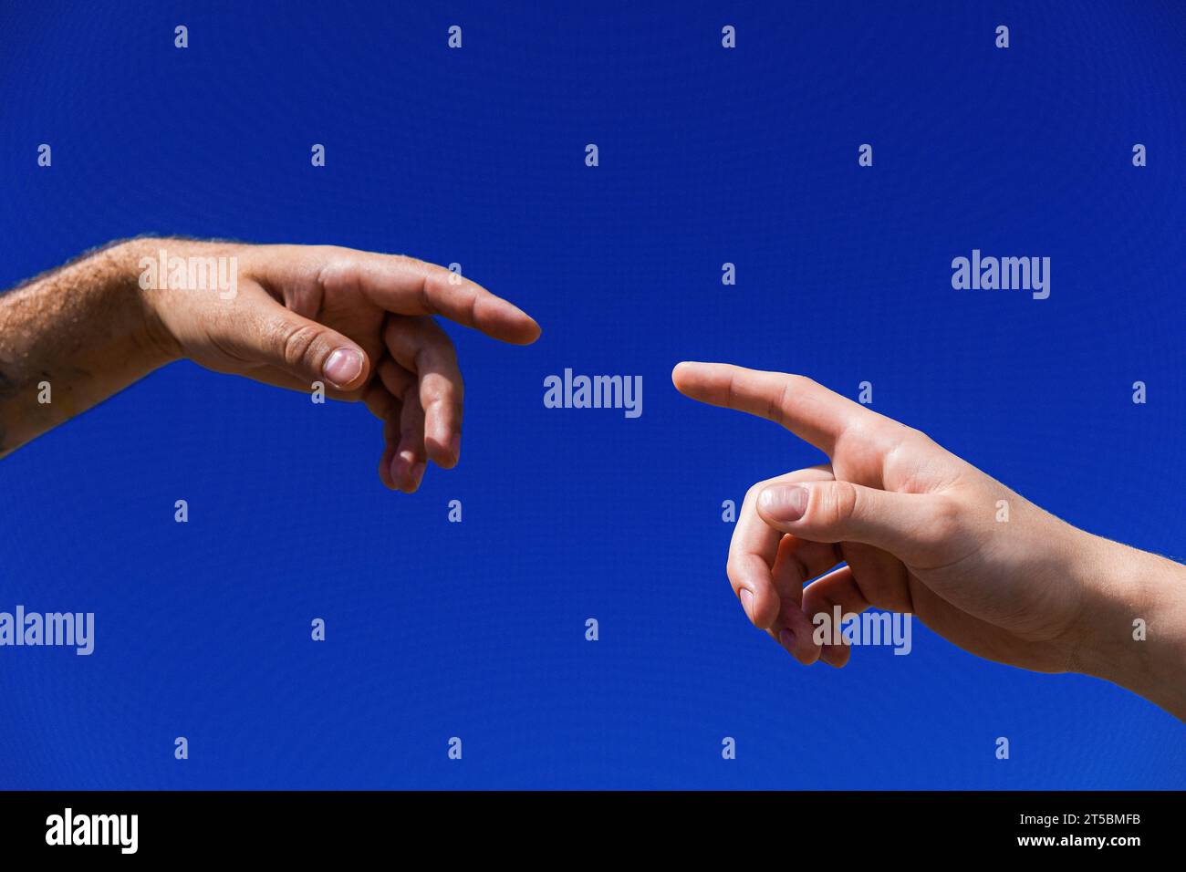 male hands on a dark blue background reach for each other Stock Photo ...
