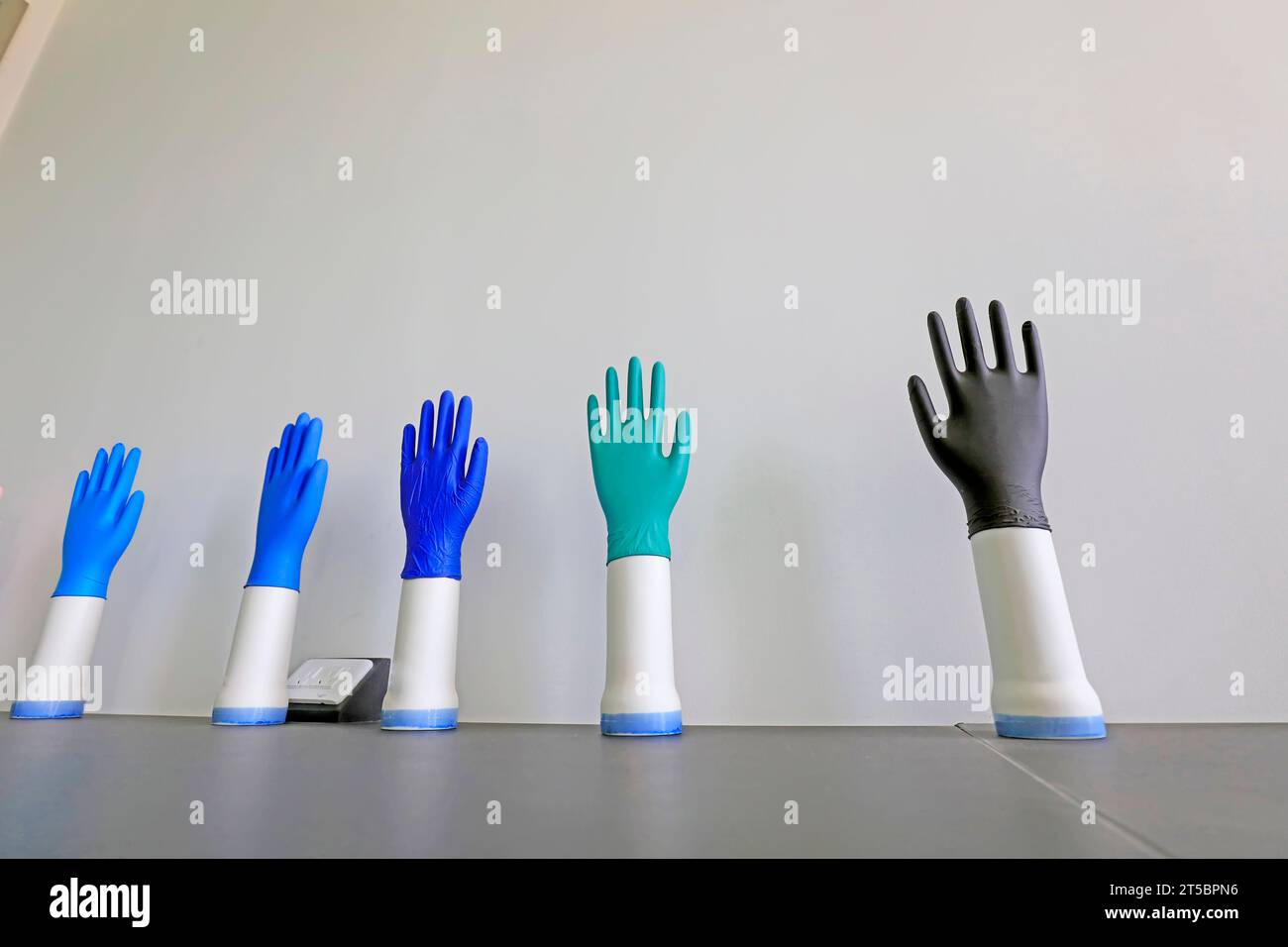 Nitrile gloves samples, closeup of photo Stock Photo - Alamy