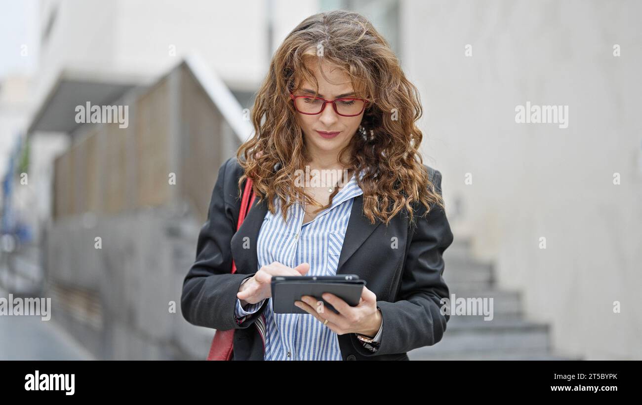Young woman using touchpad street hi-res stock photography and images ...