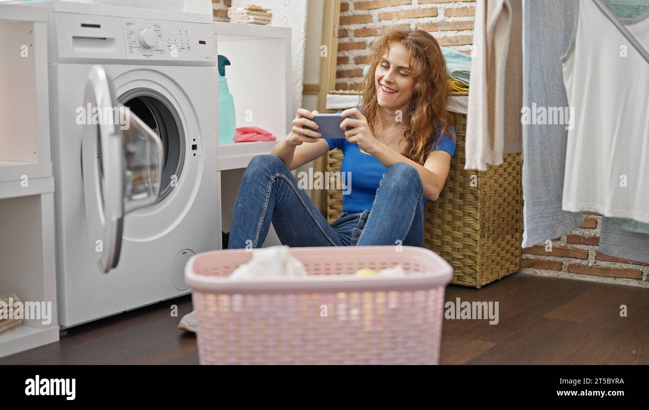 Young woman washing clothes playing hi-res stock photography and images ...