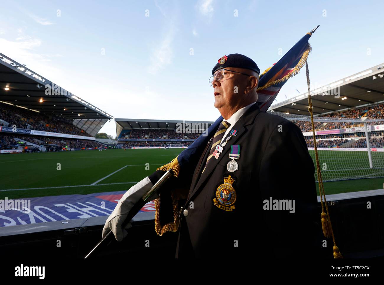 A former member of the armed forces pitch side after a minutes silence ...