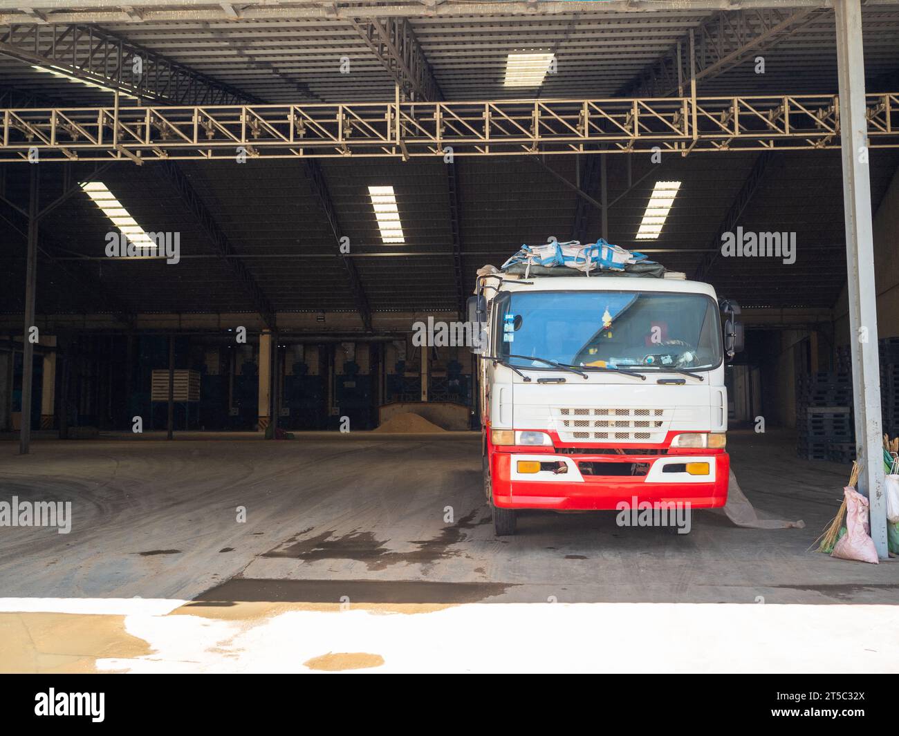 Truck unloading paddy rice at a rice milling plant Stock Photo - Alamy