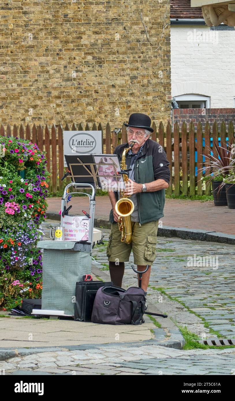 Busker wearing hat hi-res stock photography and images - Alamy