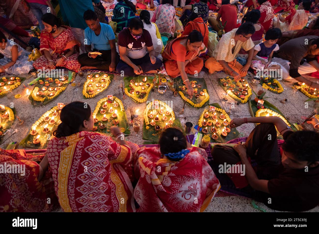 Dhaka, Bangladesh. 4th Nov, 2023. Hindu devotees sit with Prodip ...