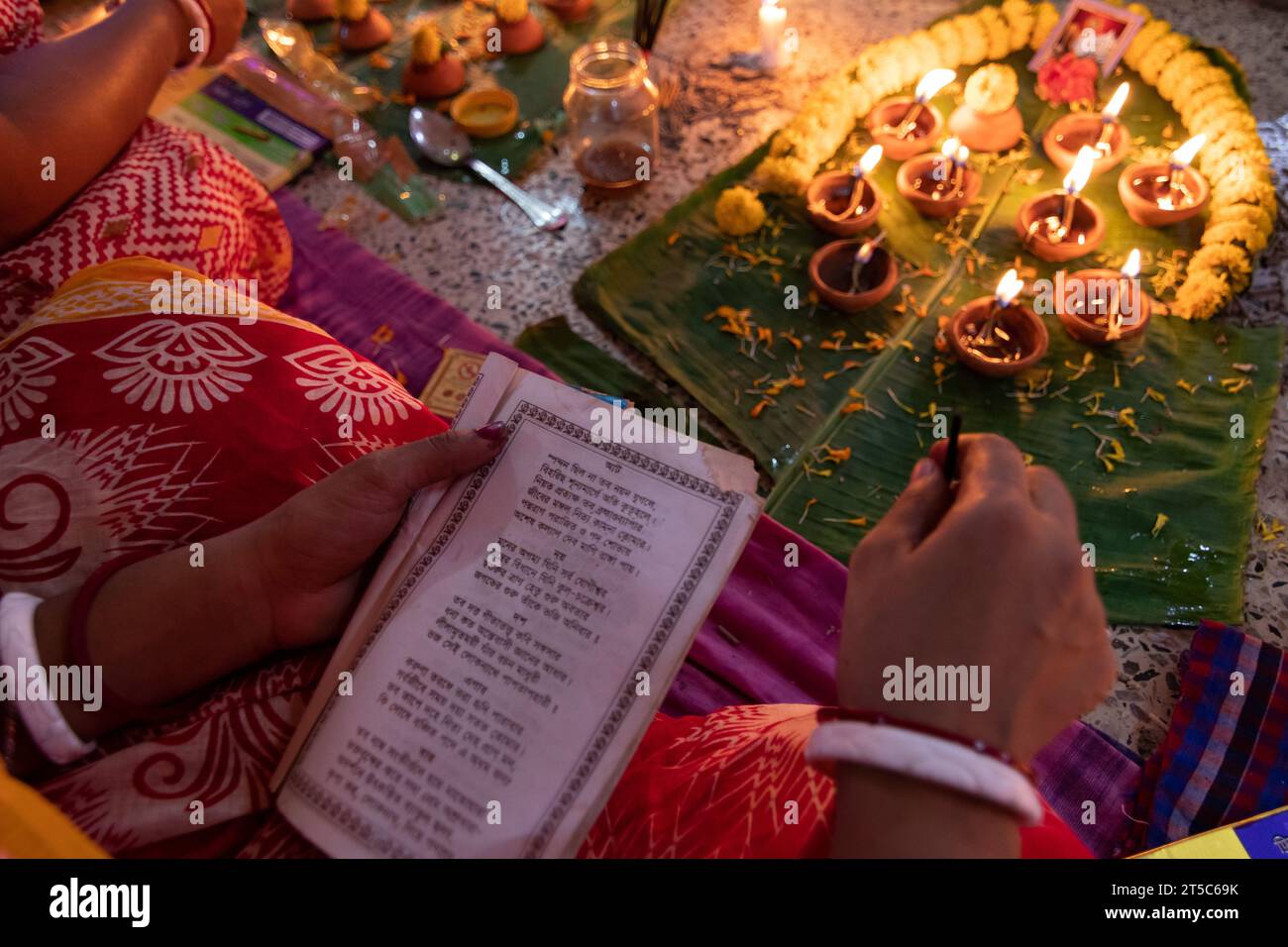 Dhaka, Bangladesh. 4th Nov, 2023. Hindu devotees sit with Prodip ...